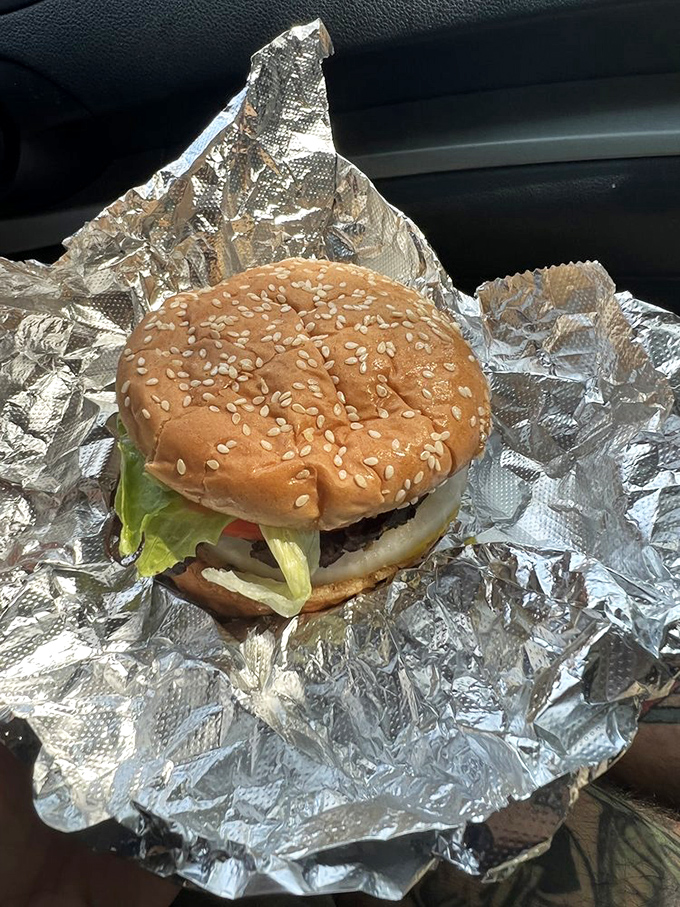A proper burger, wrapped in foil to keep all that juicy goodness contained until the moment of truth arrives.