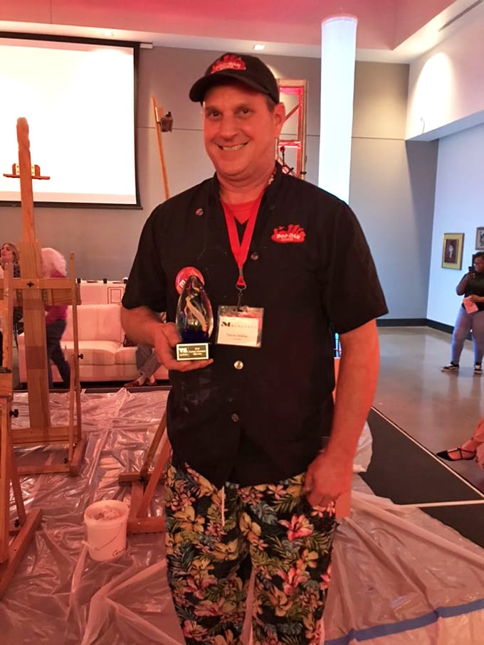 Behind every great diner is someone who understands the sacred responsibility of breakfast. The tropical pants suggest a refreshing sense of humor.