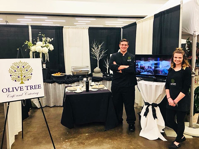 The catering team stands ready to bring Mediterranean magic to your next event. Those matching black uniforms say, "We take deliciousness very seriously."