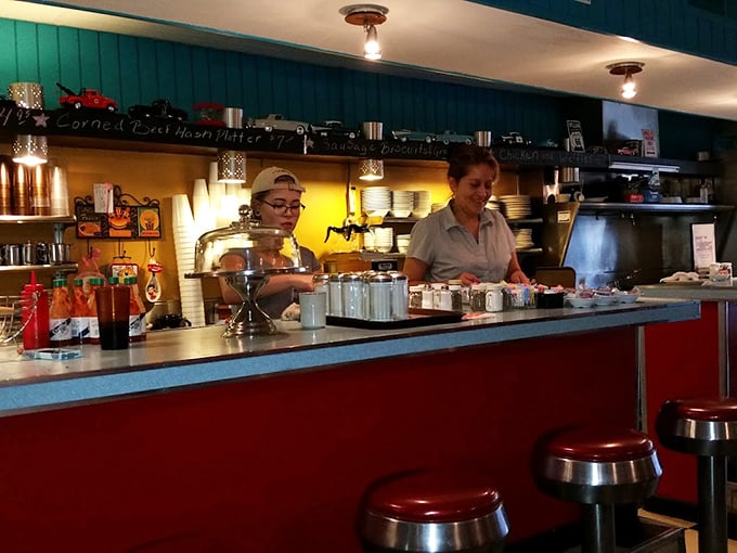 The counter crew orchestrates the morning rush with practiced efficiency, turning orders into edible memories one plate at a time.