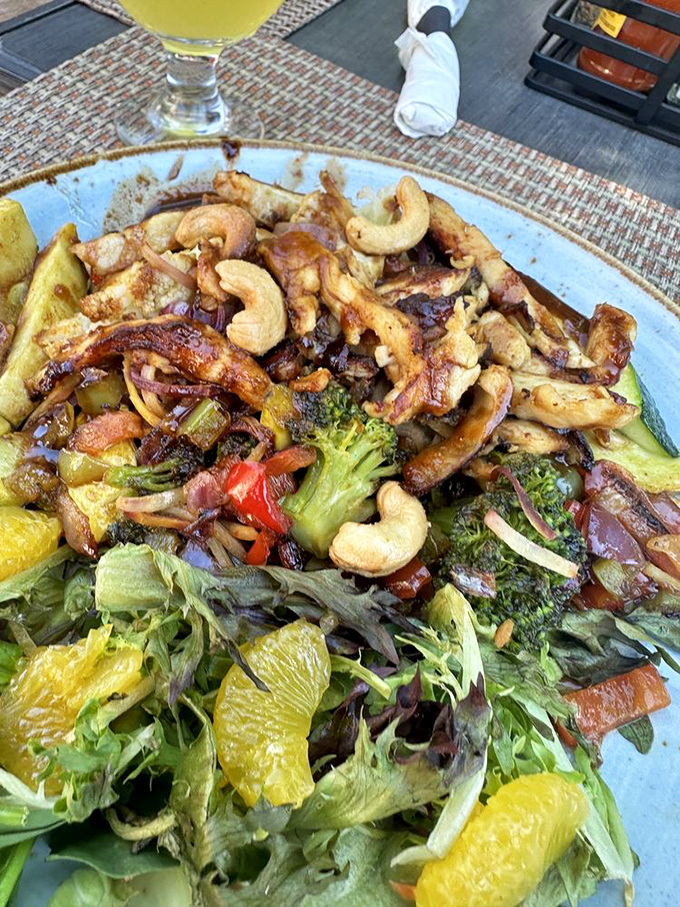 A stir-fry that's having more fun than most people on vacation. Cashews, citrus, and veggies mingling like old friends at a reunion.