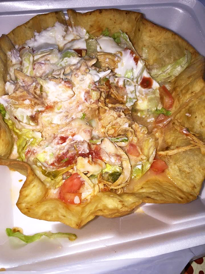 A crispy taco shell cradles a garden of flavors. The kind of dish that makes you wonder why you ever settled for fast-food Mexican.