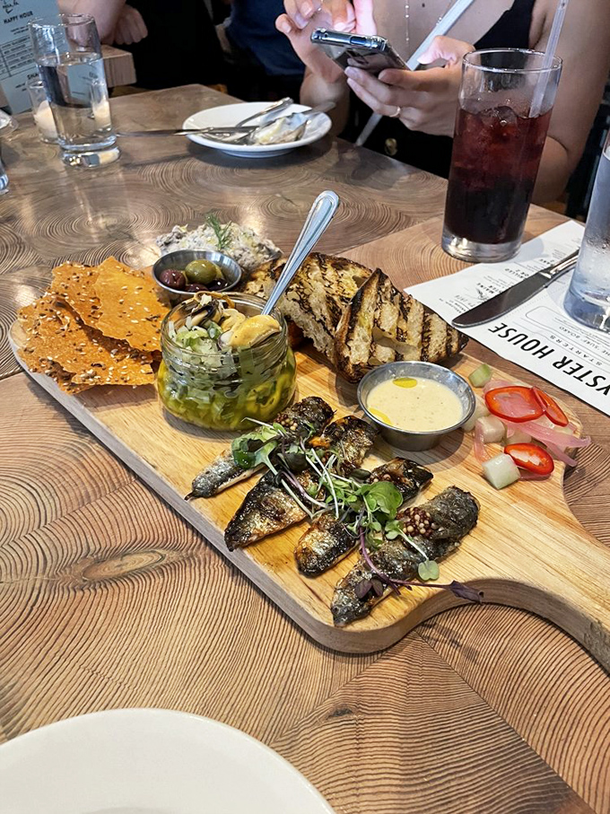 The surf board – a wooden runway showcasing seafood's greatest hits. It's like a fashion show where everything is delicious.