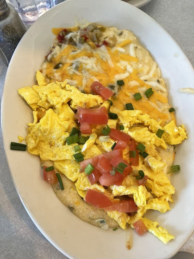 Grits elevated to an art form&mdash;creamy, cheesy, topped with scrambled eggs and fresh vegetables in a bowl that screams "Southern comfort."