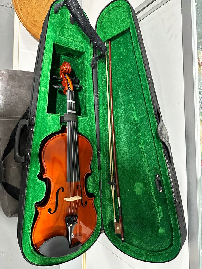 Not just a violin—a conversation piece nestled in emerald velvet. Someone's musical aspirations could be your next great find.