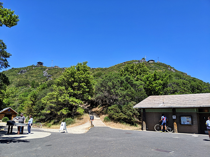 The trailhead beckons from the visitor center parking lot. That small building holds maps to adventures that will fill your camera roll and feed your soul.