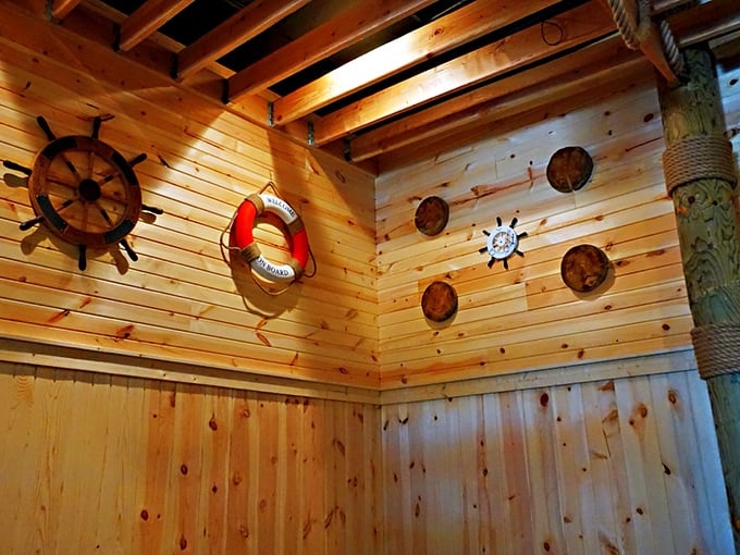 The wooden walls adorned with maritime memorabilia create an atmosphere that's somewhere between ship's cabin and coastal eatery.