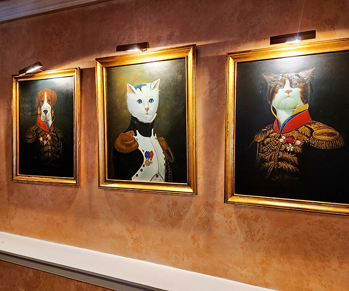 The famous aristocat portraits in all their glory! These regal felines and canines in military dress set the whimsical tone for your entire meal.