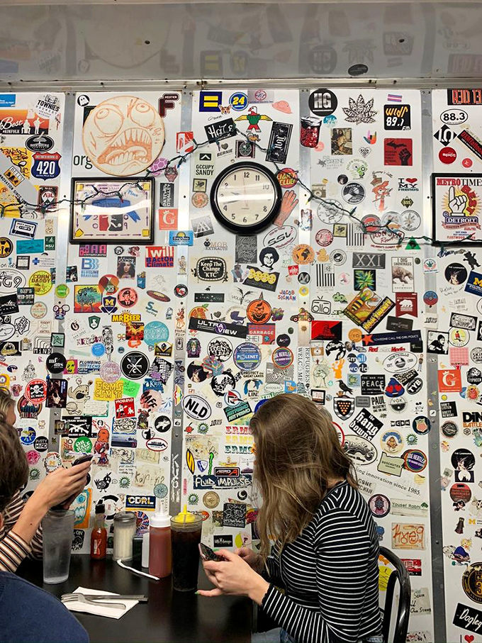 Every sticker represents someone who wanted to leave their mark. This wall is Ann Arbor's most democratic art installation.