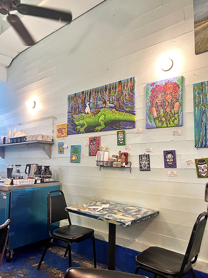 The eclectic art collection transforms simple white walls into a vibrant gallery space &ndash; New Orleans culture served alongside your breakfast.