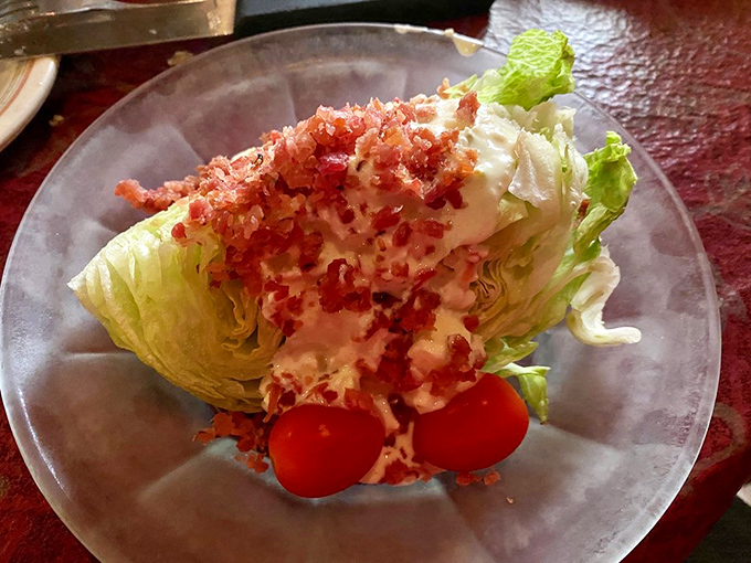 A wedge salad that makes eating vegetables feel like cheating&mdash;crisp iceberg drizzled with dressing and crowned with bacon bits.