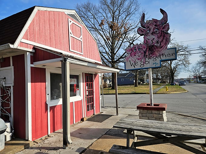 Whisler's Drive-Up, with its barn-red charm and quirky cow sign, serves up nostalgia alongside burgers. Fast food before it was fast.