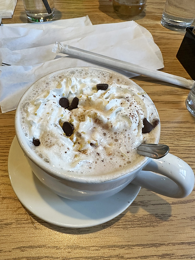 This white chocolate mocha isn't just a drink; it's a dessert masquerading as breakfast, topped with clouds of whipped cream and chocolate shavings.