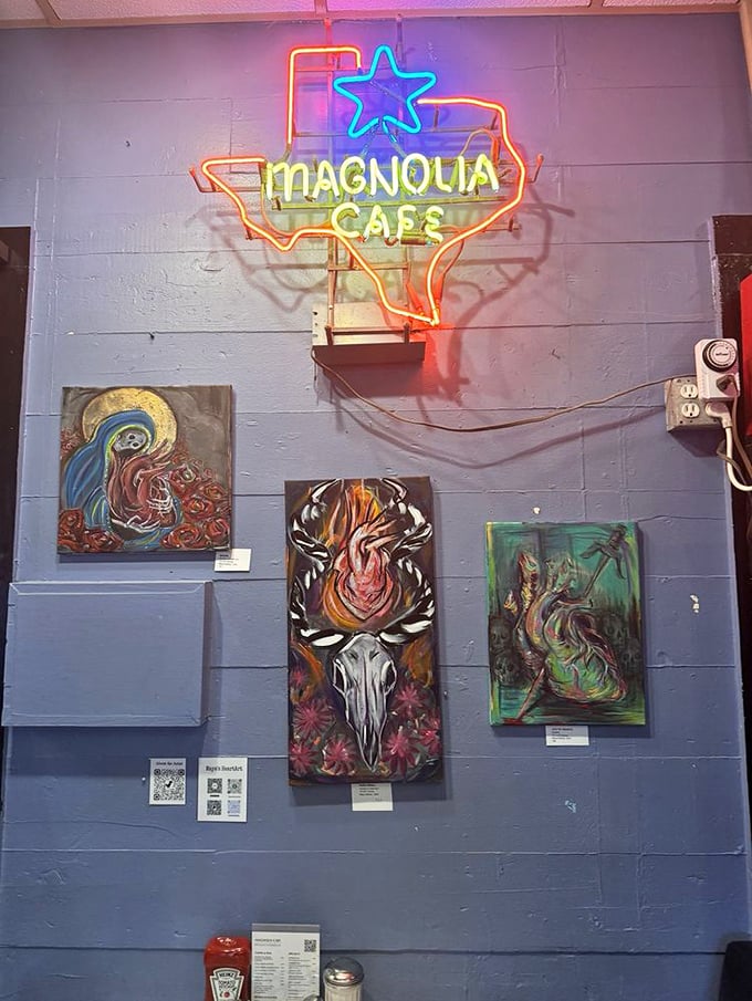 The neon Texas-shaped sign glows like a beacon for the hungry, while local art transforms ordinary walls into an impromptu gallery celebrating Austin's creative spirit.