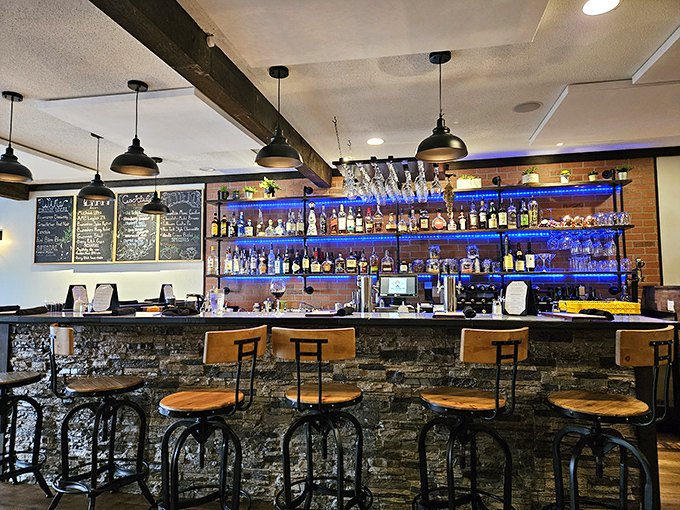 The bar area combines contemporary design with mountain charm, offering a welcoming space to enjoy a pre-dinner drink or post-hike refreshment.