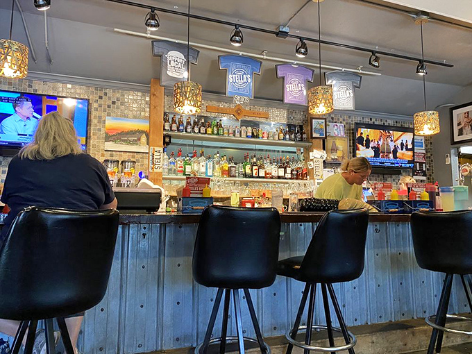 The bar area&mdash;where strangers become friends united by the universal language of "Have you tried their burgers yet?"