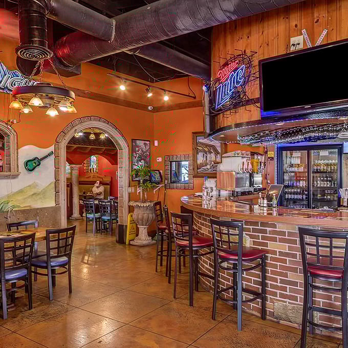 The bar area doesn't just serve drinks&mdash;it creates the kind of atmosphere where "just one more" seems like the most reasonable suggestion ever.