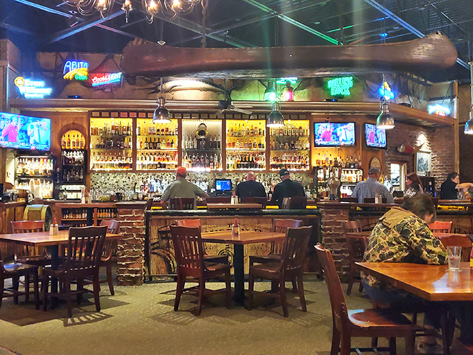The bourbon bar doesn't just offer drinks &ndash; it showcases an amber library of possibilities beneath what appears to be a canoe hanging overhead.