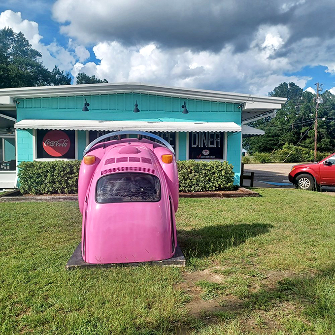 The iconic pink Beetle out front is like the diner's mascot—quirky, memorable, and impossible to miss even on your fastest drive-by.