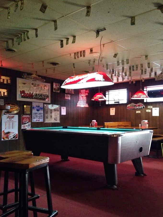 Even the pool table has dollar bills watching over it. This game room offers the perfect intermission between rounds of ribs and cold beer.