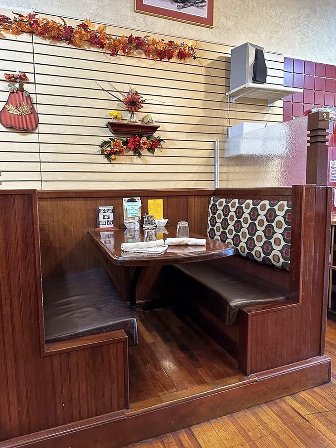 This isn't just a booth&mdash;it's your personal dessert sanctuary. The honeycomb pattern on that cushion? Subliminal messaging to order something sweet.