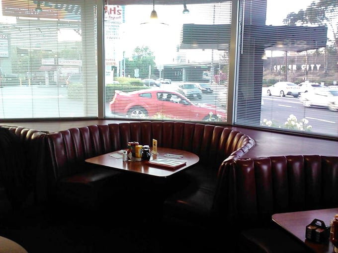 Corner booths: where privacy meets panorama. The best seat in the house for people-watching and secret conversations.