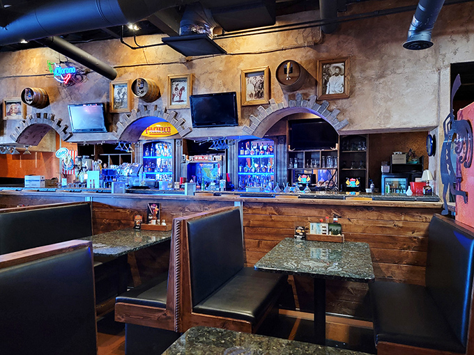 Booths lined with rich wood and warm lighting create intimate spaces for serious conversations about whether to order dessert (the answer is always yes).