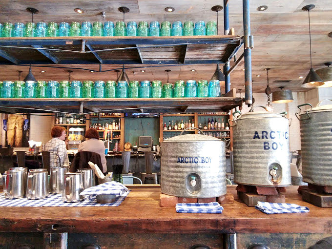Those turquoise mason jars aren't just pretty d&eacute;cor &ndash; they're part of the coastal-meets-industrial aesthetic that makes Peacemaker feel like a secret club for seafood lovers.