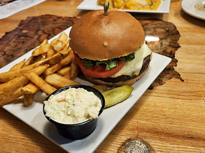 This isn't just a burger—it's a landlubber's lifeline in a sea of seafood options, complete with crispy fries and homemade coleslaw.