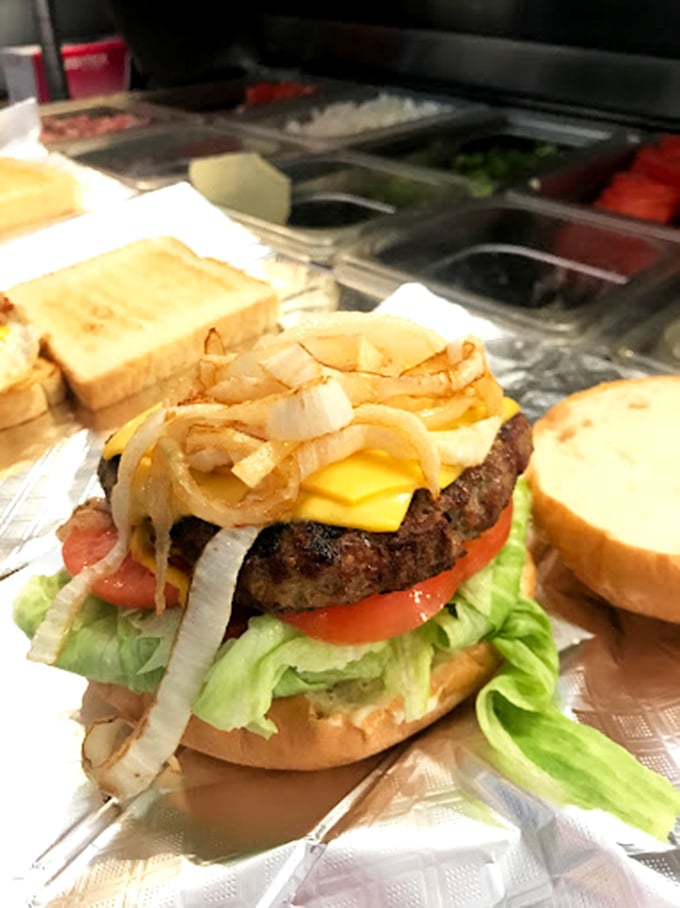 The burger that launched a thousand lunch breaks&mdash;stacked with fresh veggies and melty cheese on a perfectly toasted bun.