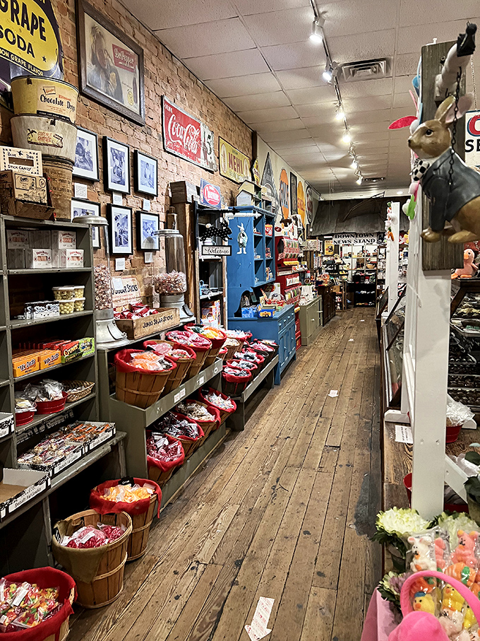 Exposed brick walls and weathered wood shelving provide the perfect rustic stage for this technicolor performance of confectionery classics.