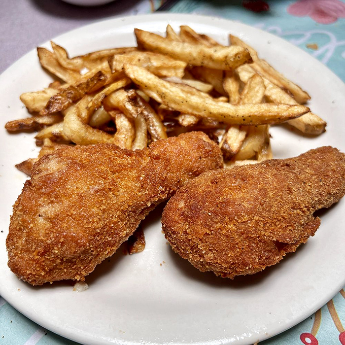 Two pieces of golden perfection with fries that somehow manage to be both rustic and elegant &ndash; like country cooking in a tuxedo.