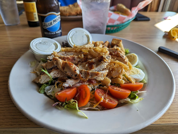 A salad that means business! Grilled chicken, fresh veggies, and those perfectly placed hard-boiled eggs create the kind of lunch that fuels afternoon adventures.