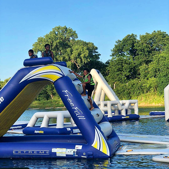 Climbing to the top just to slide back down&mdash;a metaphor for life, but way more fun. These kids understand the joy of conquering inflatable mountains.