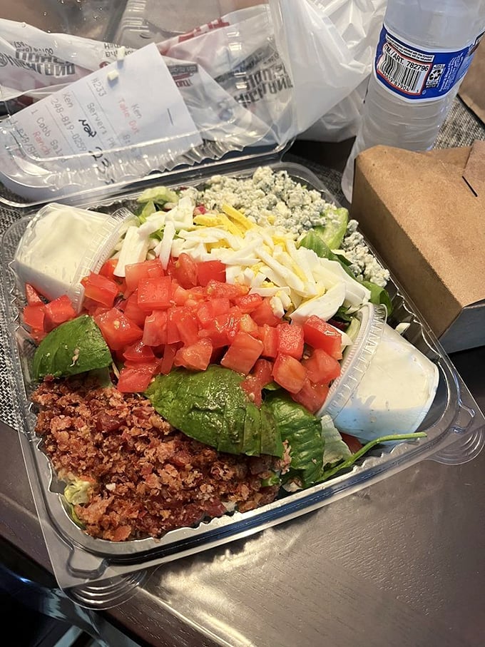 Salad architecture at its finest&mdash;layers of freshness topped with what appears to be bacon bits, because vegetables deserve good company too.