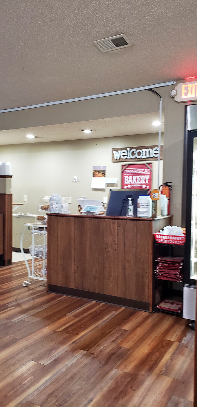The welcome counter, where first-timers become regulars and regulars become family. Note the bakery sign promising additional temptations.