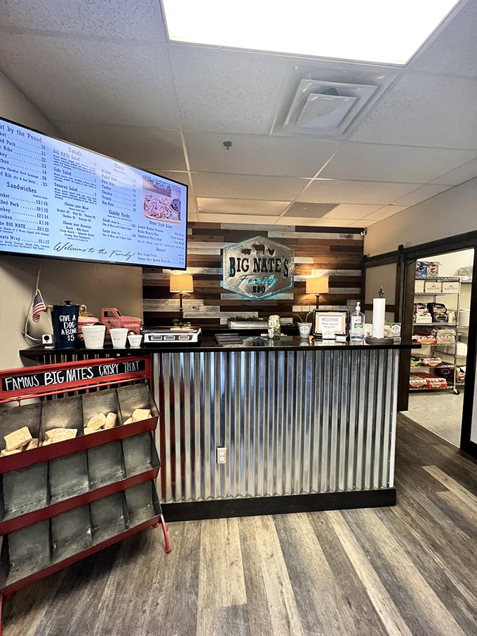 The corrugated metal counter says "we're serious about barbecue" while the welcome sign says "but not too serious about ourselves."