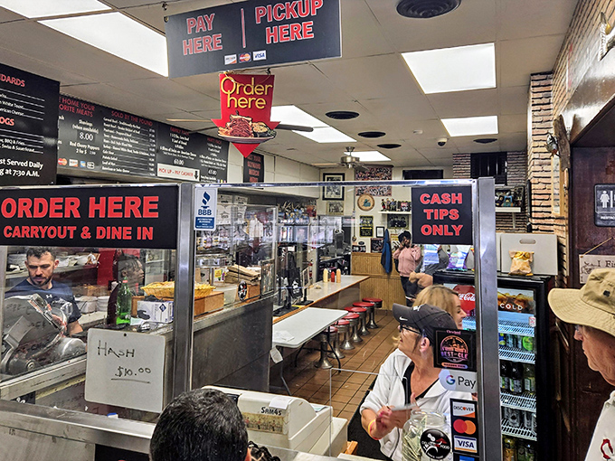 Where sandwich dreams become reality. The "Order Here" sign might as well say "Abandon diet, all ye who enter here."