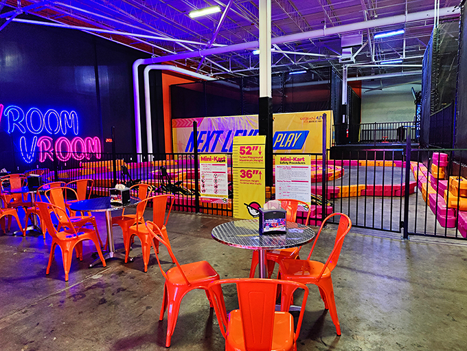 The "ROOM VROOM" neon sign perfectly captures what happens to your heart rate when you strap into these electric speed machines.