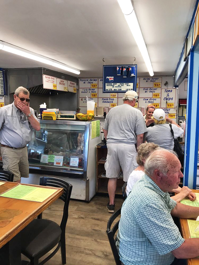 Regulars and first-timers alike studying the menu with the concentration of scholars. Important decisions being made here.