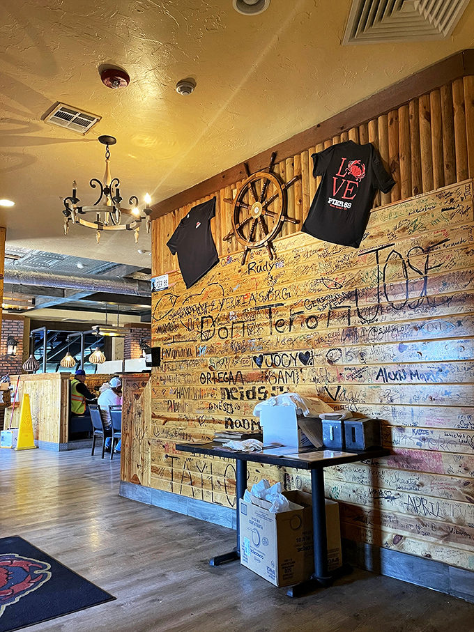Nautical wheels and wooden walls signed by satisfied customers&mdash;like a seafood joint's version of the Hollywood Walk of Fame.