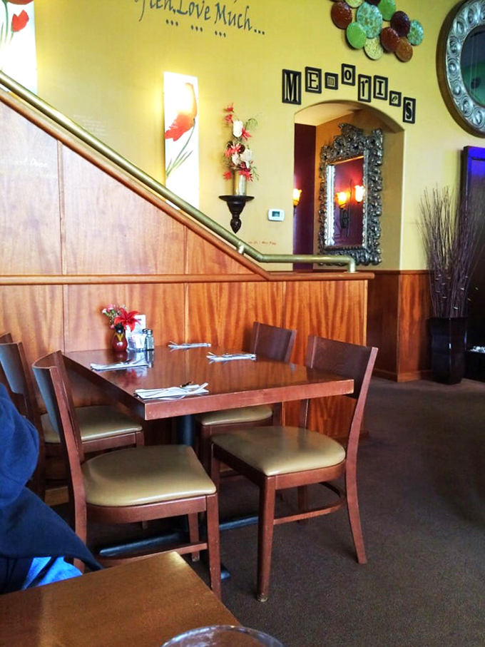 The wall says "Memories" but it's really saying "Slow down and stay awhile." Yellow walls and wood paneling create the perfect backdrop for your next favorite story.