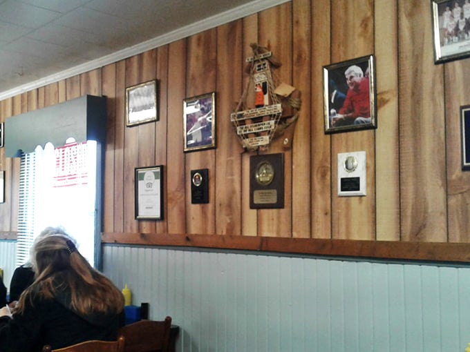 The wall of fame tells stories of community pride, fishing triumphs, and decades of serving Columbus's hungry masses.
