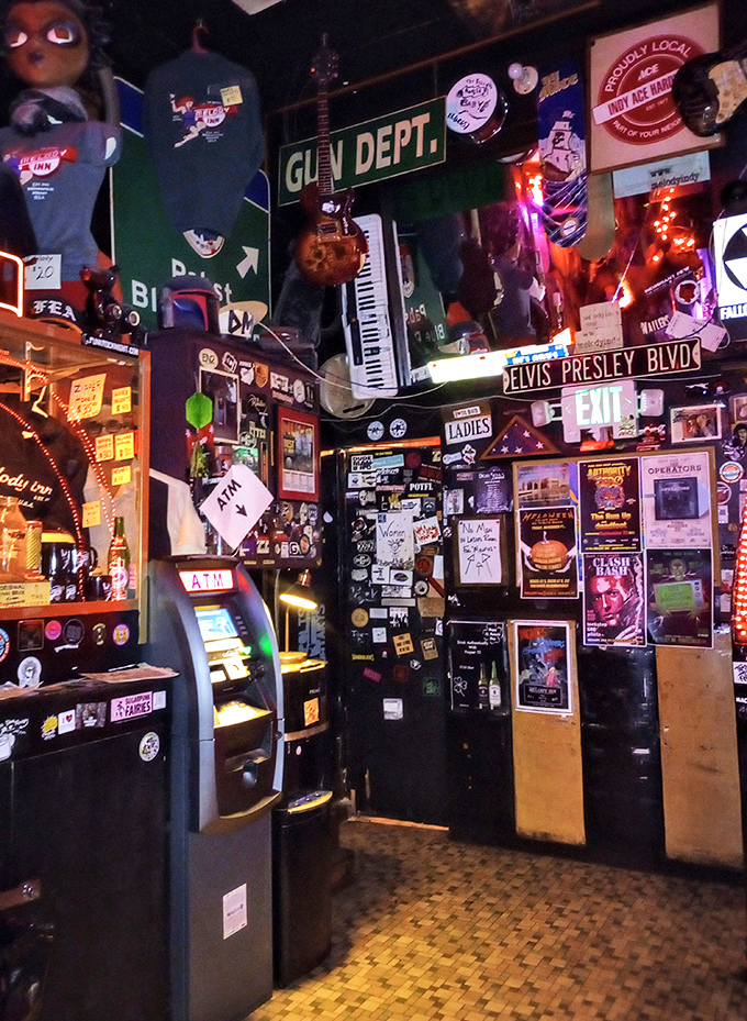 Somewhere between organized chaos and artistic genius, this corner features an "Elvis Presley Blvd" sign because... of course it does.