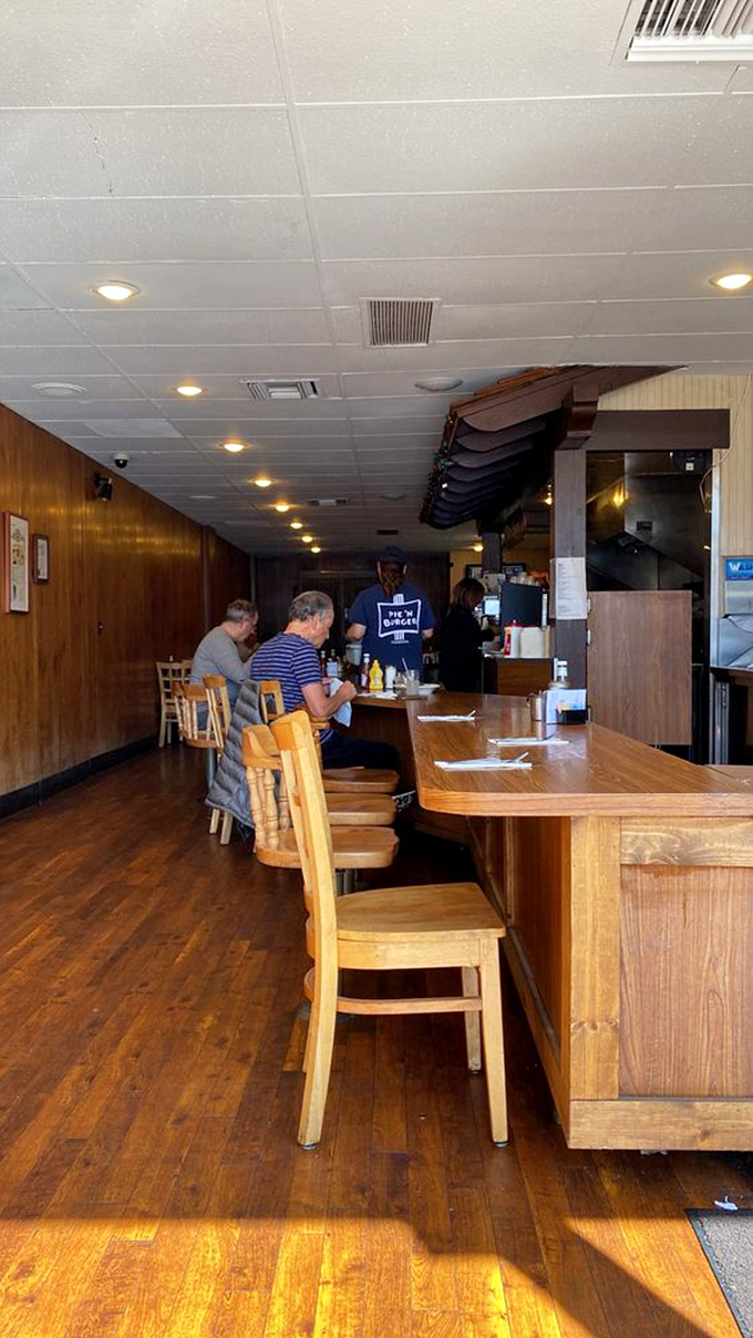The wooden counter has heard thousands of conversations and witnessed countless first bites of burger bliss. If these seats could talk!