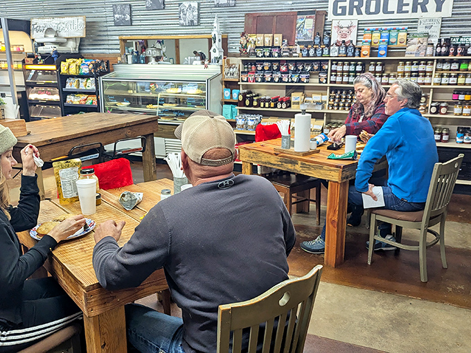 Where strangers become neighbors over sandwiches. The real Arkansas social network happens at these wooden tables.