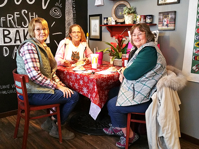Three friends sharing treats and conversation&mdash;the universal language of "you've got to try this" transcends all cultural barriers.
