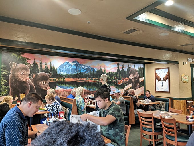 Where mountain murals meet mealtime magic. Even the bears on the wall look impressed by what's happening on those plates.