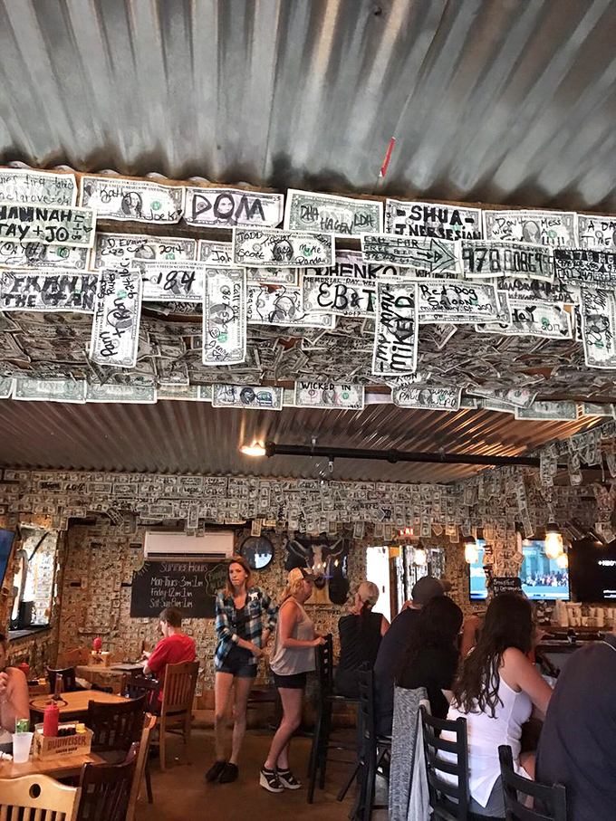 The dollar-bill-covered walls create the perfect backdrop for Hampton's hungry masses. Each bill tells a story; each patron adds to the legend.