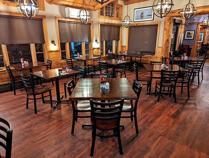 Evening light transforms simple tables into intimate dining sanctuaries. Those wooden beams have overheard thousands of "we need to come back" promises.
